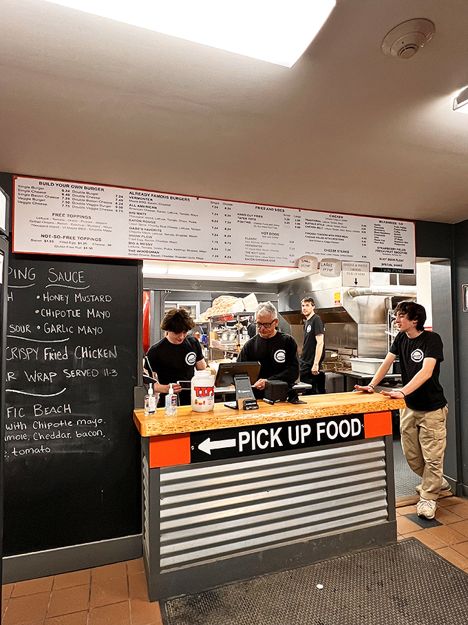The open kitchen setup feels like dinner theater, with skilled staff orchestrating a delicious symphony of burgers and shakes.