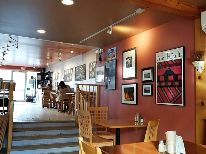 Pink walls, wooden beams, and local art transform this space into your coolest friend's living room - just with better coffee.