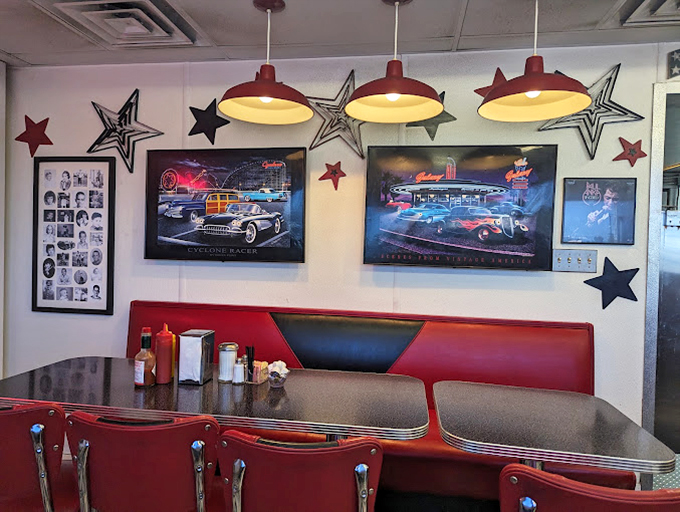 Classic car artwork and metallic stars add authentic hot rod culture flair to every cozy booth conversation.