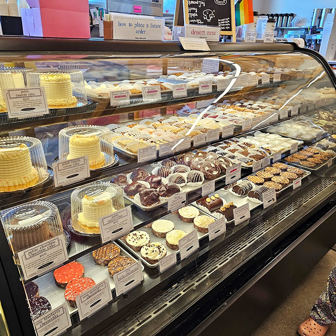 Layer upon layer of sweet temptation beckons from behind glass, like a museum of edible art you can actually take home.