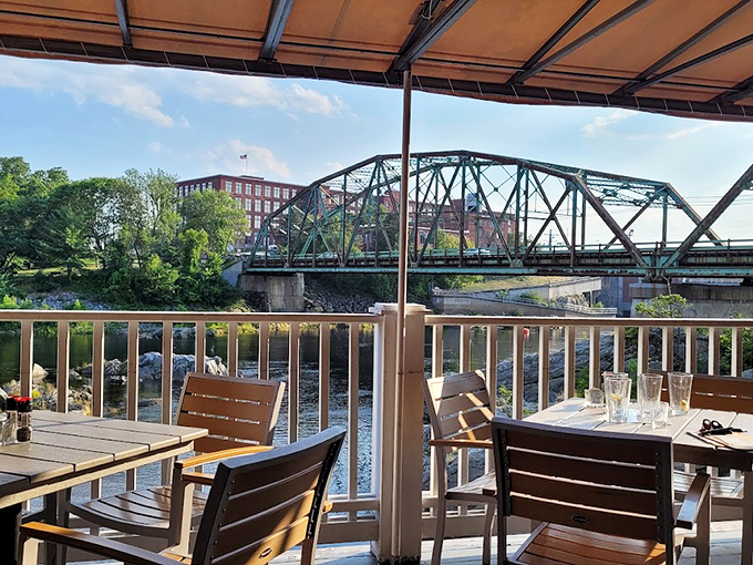 The deck offers front-row seats to nature's dinner theater, complete with river views and that perfect Maine breeze.