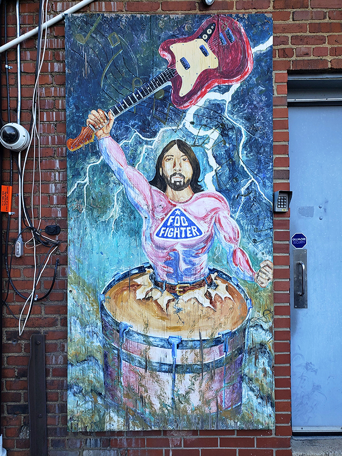 Holy Foo Fighters, Batman! Dave Grohl emerges from a drum kit like a rock 'n' roll superhero ready to save the world.