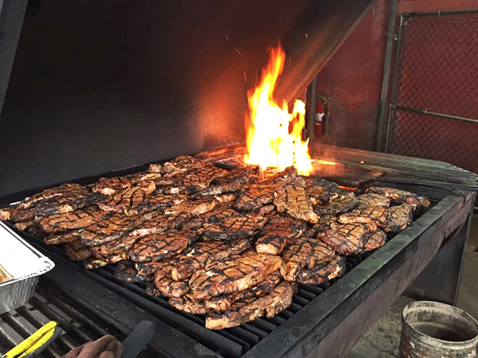 Holy smoke! These ribs are getting the VIP treatment on the grill, basking in flames like sunbathers on a meaty beach.