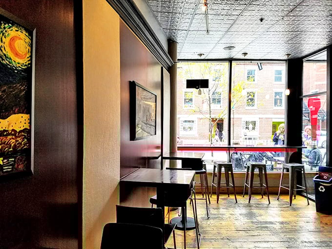 Modern industrial meets cozy comfort in this stylish space, where exposed ceilings and warm wood create the perfect gelato-enjoying atmosphere.