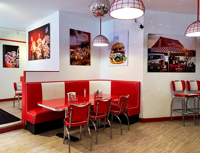 Classic red and white booths meet disco ball sparkle &ndash; it's like a 1950s diner threw a party and invited 2023 to join.