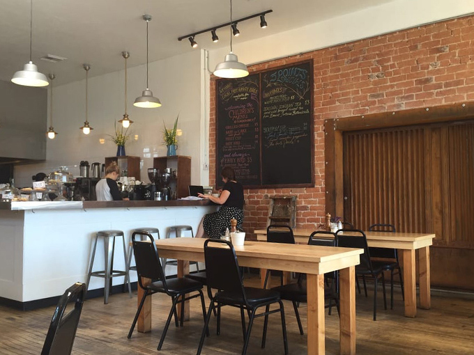 Modern meets cozy in this sunlit space, where every table feels like the best seat in the house. Photo credit: Elena M.