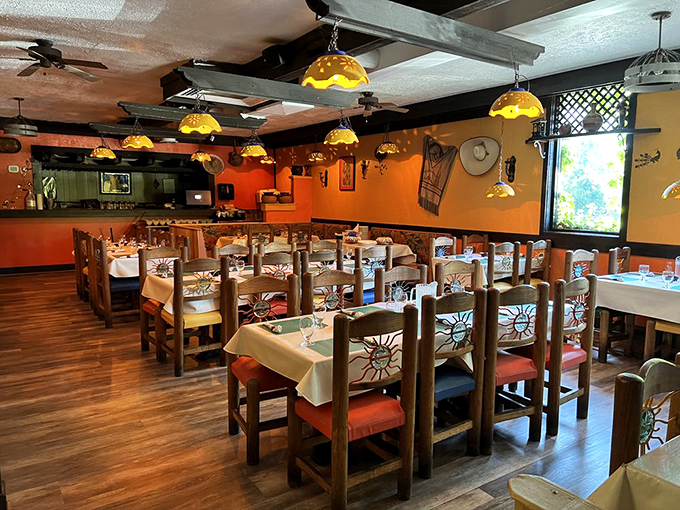 Hand-carved wooden chairs and ambient lighting create the perfect setting for those "just one more enchilada" moments.