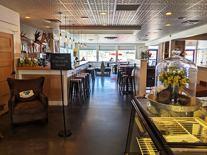 Modern meets maritime in this thoughtfully designed space, where pendant lights cast a warm glow over comfortable seating.