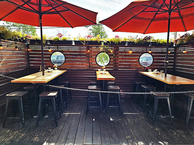 Three's company at this charming outdoor setup, where porthole mirrors and string lights transform alfresco dining into maritime magic.