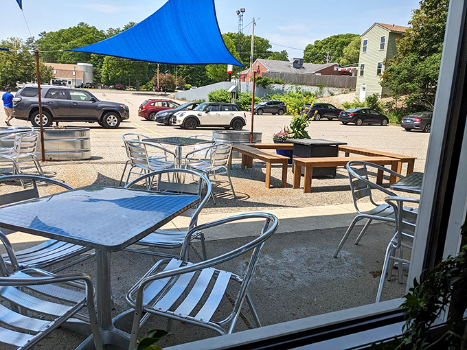 A breezy outdoor patio complete with azure sun sails offers the perfect spot for summer dining and people-watching. Photo credit: Nicole Schwartz