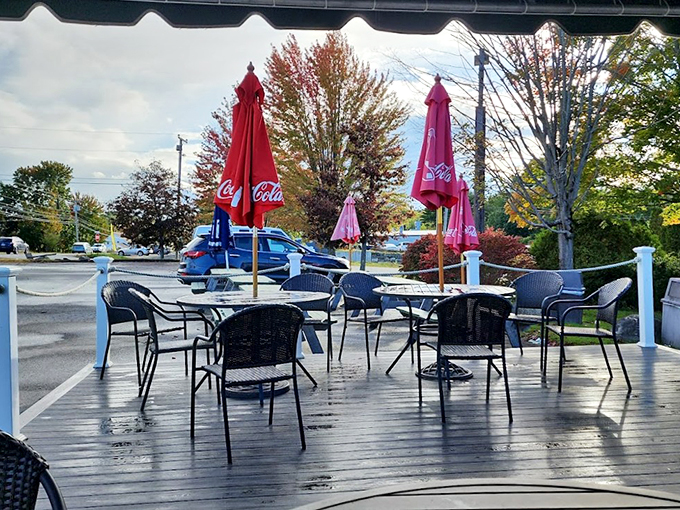 Maine's answer to al fresco dining: a charming deck where Coca-Cola umbrellas provide shade while you feast on ocean treasures.