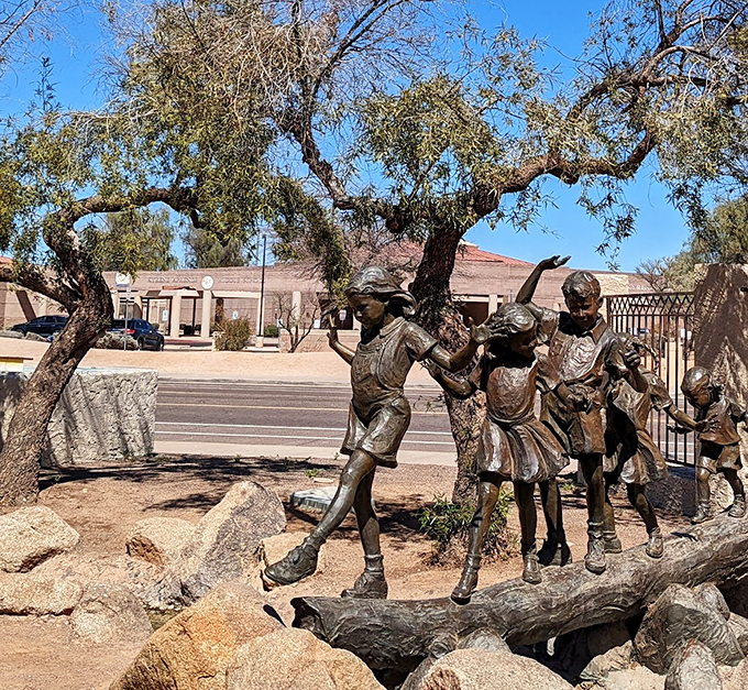 Who says you can't climb trees anymore? This bronze statue is living out every parent's climbing nightmare and every child's dream. Photo credit: DeEdra Manning