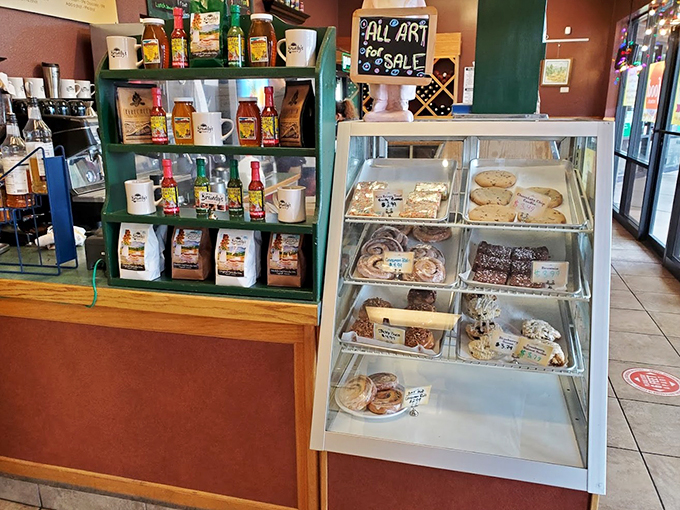 Dessert for breakfast? Don't mind if I do! This display case is like a treasure chest of sugary delights, each pastry a golden ticket to flavor town. 
