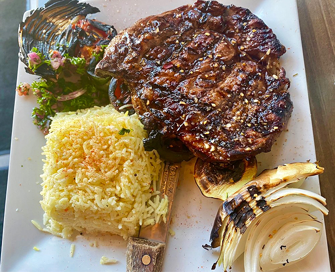A perfectly grilled steak shares the spotlight with aromatic rice and grilled vegetables in this Middle Eastern-meets-steakhouse masterpiece.