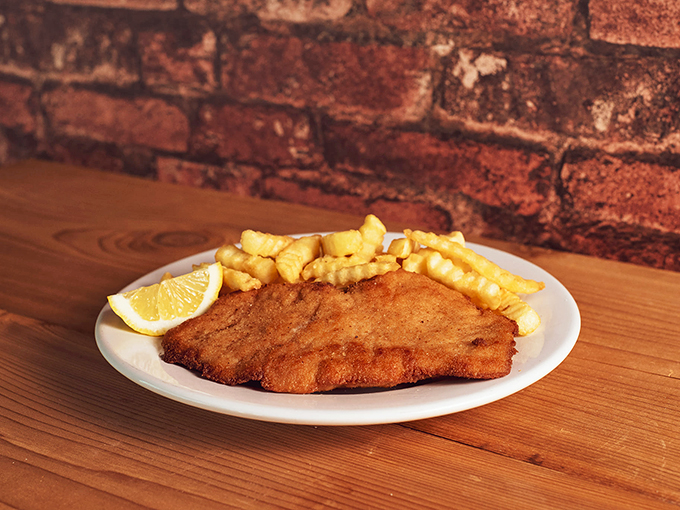 Crispy meets fluffy! This schnitzel and fries plate is a textural tango that'll make your taste buds dance.