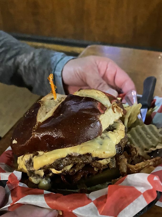 Schu Burger This pretzel bun beauty isn't just a burger - it's edible architecture with melted cheese for mortar.