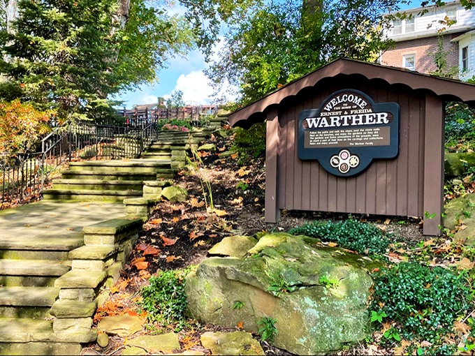 All aboard the whimsy express! This charming sign marks the start of your journey into a world where trains are tiny and imagination is king.