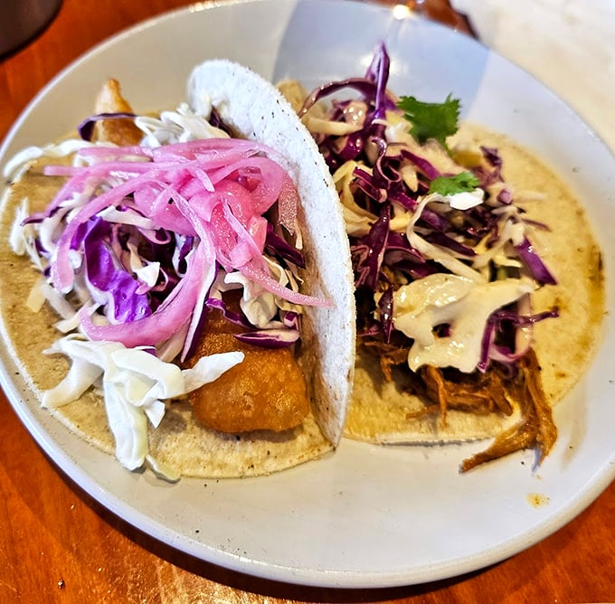 These fish tacos aren't just dinner - they're a celebration, with purple cabbage confetti and pickled onions adding a festive pop.