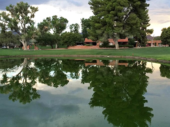 Mirror, mirror on the pond, who's the fairest golf course around? Tubac's serene water features reflect the beauty of the surrounding trees, creating a golfer's paradise.