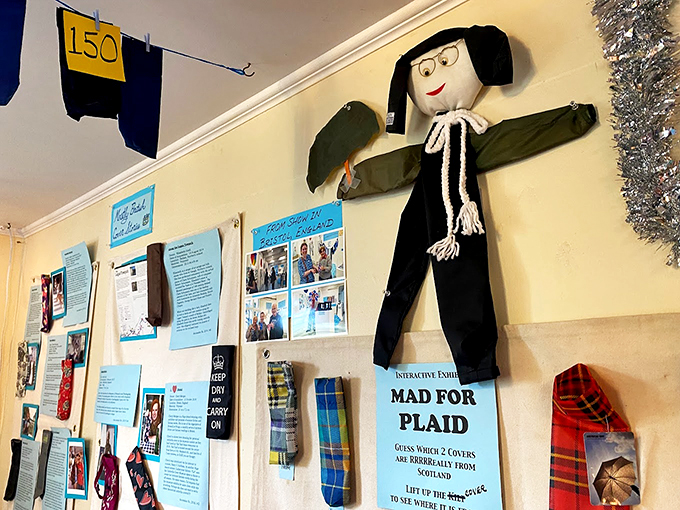 "Mad for Plaid" and other clever exhibits transform ordinary umbrella covers into conversation pieces. That scarecrow figure definitely has stories to tell!