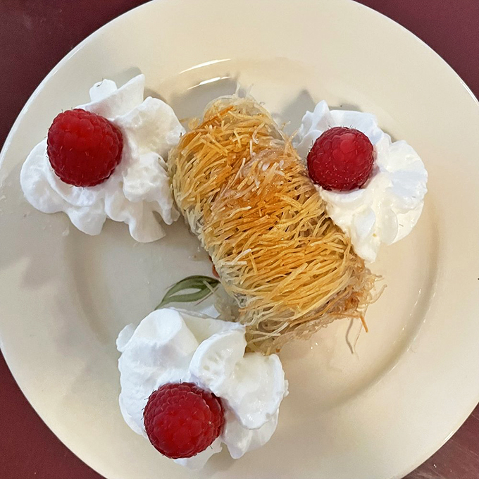 Honey, I shrunk the pastry! This delicate baklava, nestled in whipped cream, is a sweet reminder that good things come in small, flaky packages. Photo credit: Janis A.