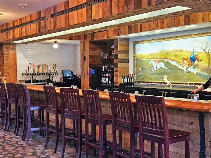 Saddle up to this bar for a taste of the good life! The equestrian-themed artwork adds a dash of whimsy to your libation location.