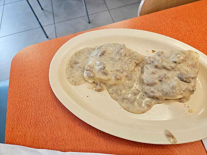 Biscuits swimming in gravy so good, you'll want to dive in headfirst. Southern comfort on a plate!
