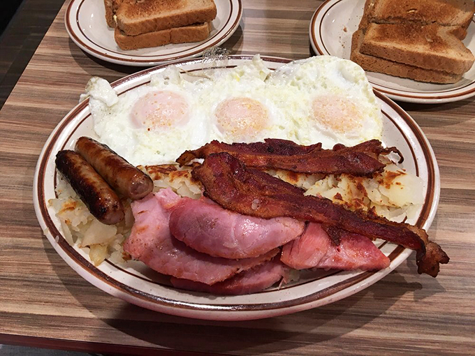 A breakfast that means business: perfectly sunny eggs, crispy bacon, and golden hash browns team up for the ultimate morning power move.