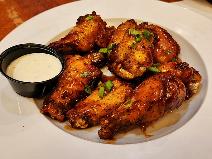 These wings aren't just hot, they're on fire! Crispy, saucy, and begging to be devoured &ndash; resistance is futile, my friends. Photo credit: Dawn Russell