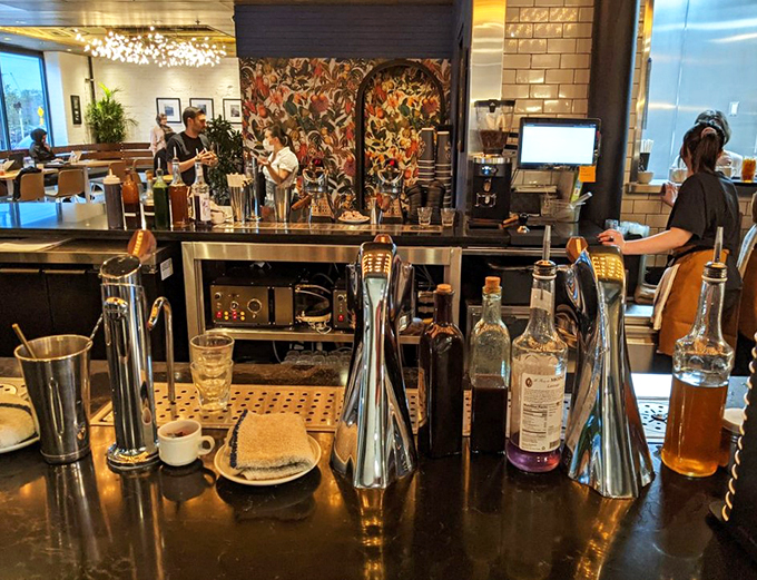 Barista paradise or liquid art gallery? This coffee bar is where your caffeine dreams come true, complete with a colorful mural that'll wake you up faster than the espresso.