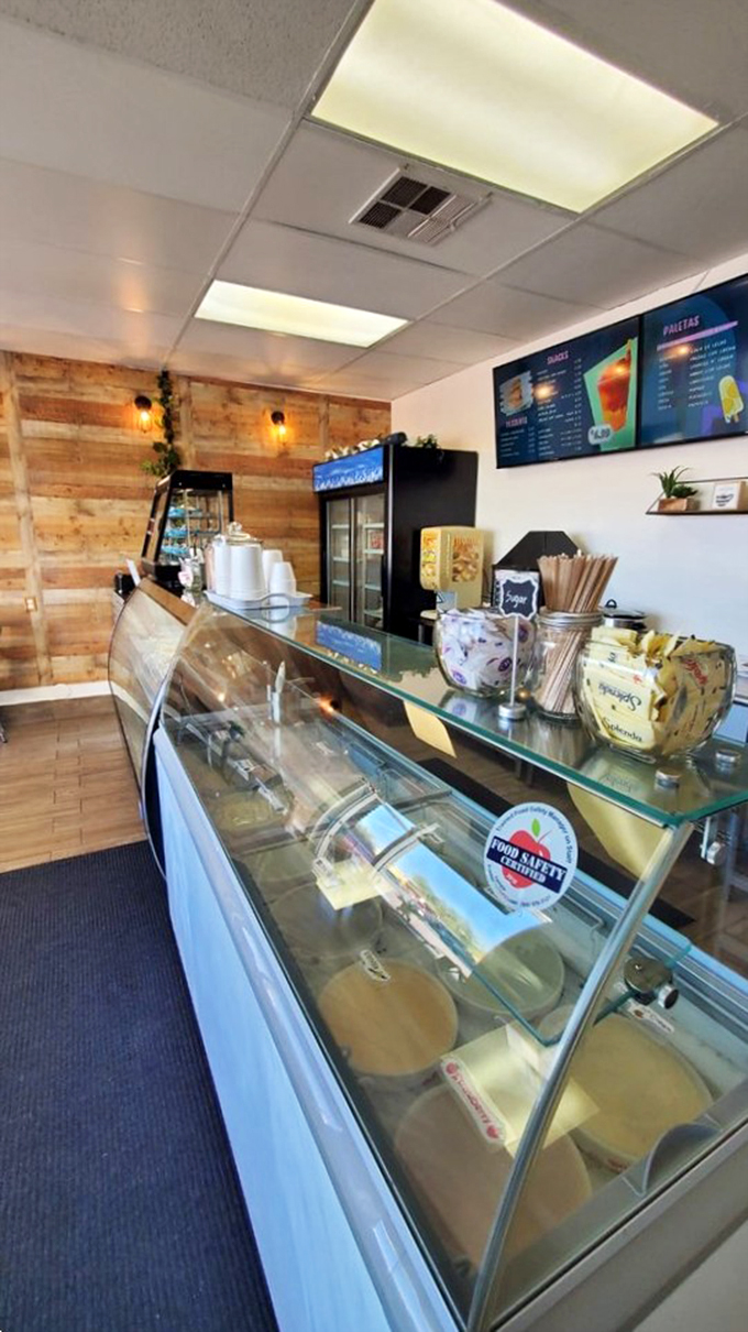 Clean lines and modern display cases showcase an array of treats, while wood accents add warmth to this cozy space.