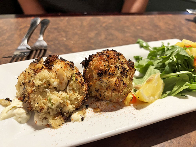 Behold, the stars of the show! These golden-brown crab cakes are so packed with succulent meat, they might just start singing "Under the Sea." Photo credit: Tony P.