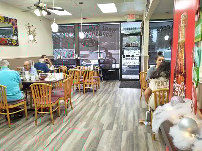Cozy up in this charming dining area, where every table feels like you've scored the best seat in the house. Photo credit: Robert Negron