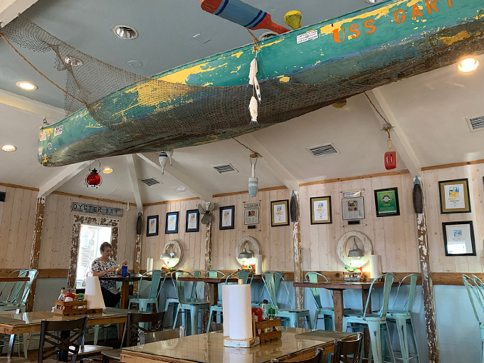 Ahoy, seafood lovers! This nautical nook is where lobster dreams come true. That boat hanging from the ceiling? It's not just decor&mdash;it's your ticket to flavor town! Photo credit: kimberly