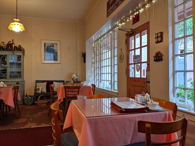 Twinkle lights and pink tablecloths? It's like prom night for your taste buds! This dining area sets the stage for a romantic rendezvous with comfort food. Photo credit: Ryan Seyersdahl