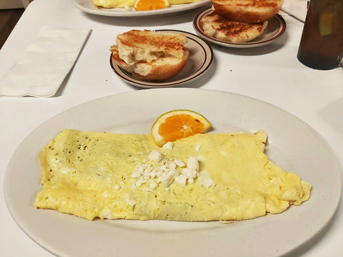 Behold, the omelet that launched a thousand breakfasts. This fluffy masterpiece is so perfectly folded, it could teach origami classes on the side.