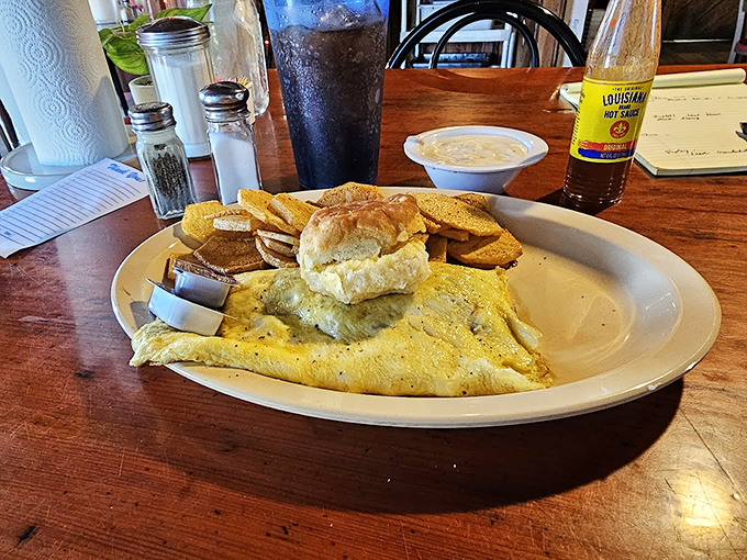 Behold, the omelet that ate Cross City! This golden giant is so fluffy, it might just float away if not for its hearty fillings.