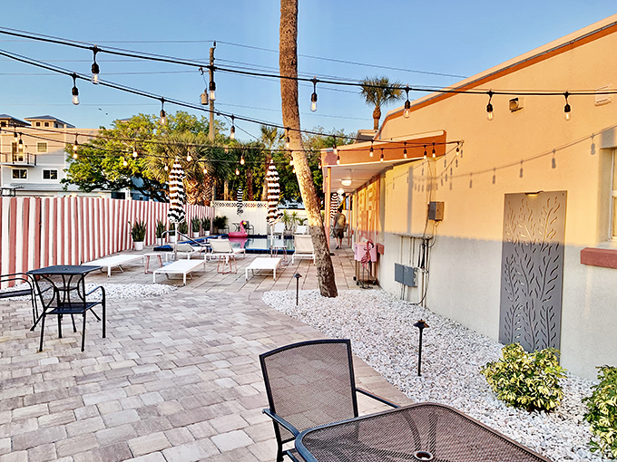 Strings of lights, striped umbrellas, and comfy loungers &ndash; it's like a retro beach party waiting to happen. Don Draper would approve!