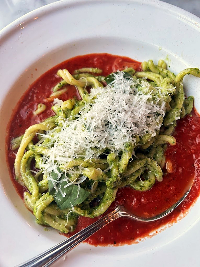 This isn't just pasta, it's a green dream machine. Pesto-licious noodles nestled in a tomato lagoon&mdash;it's like springtime and summer had a delicious baby.