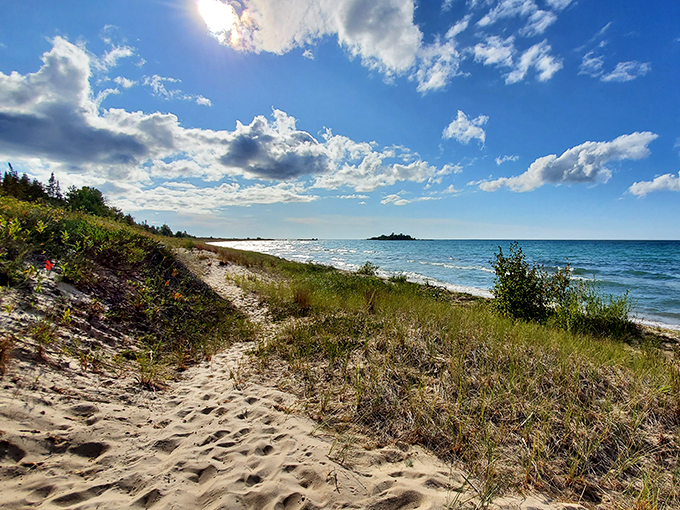 Sand, sky, and serenity: the holy trinity of beach bliss. This view is more refreshing than a glass of ice-cold lemonade on a hot summer day.