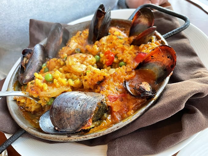Seafood symphony in a skillet! This paella's got more layers than a telenovela and twice the drama. Prepare for a flavor fiesta!