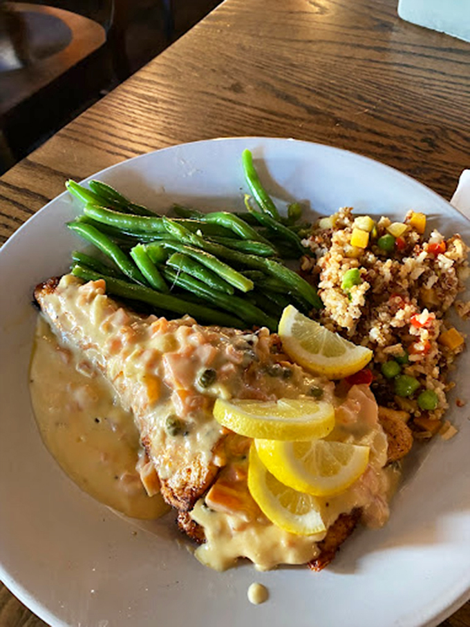 Perfectly seared walleye draped in a luxurious lemon sauce, accompanied by vibrant green beans and quinoa that's definitely not your grandmother's rice pilaf.