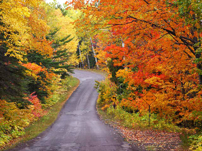 Welcome to the edge of the world! This road curves like a smile, as if Mother Nature's saying, "Gotcha!" Photo credit: Copper Harbor