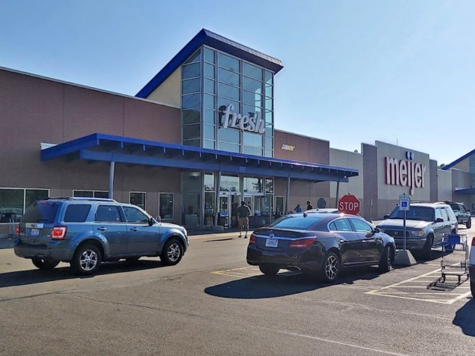 Supermarket or supercenter? Meijer's sleek blue facade houses a retail universe where groceries meet garden gnomes.