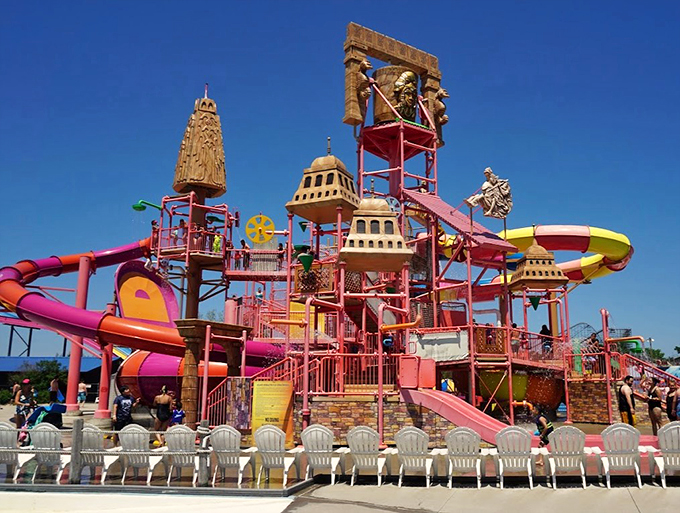 A sprawling outdoor pool complex with colorful slides proves Zeus knew exactly what he was doing with this waterpark design.