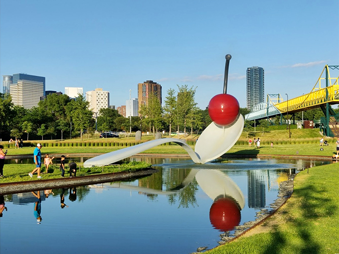 Honey, I shrunk the humans! Claes Oldenburg's iconic Spoonbridge and Cherry makes you feel like you've stumbled into a giant's kitchen utensil drawer.