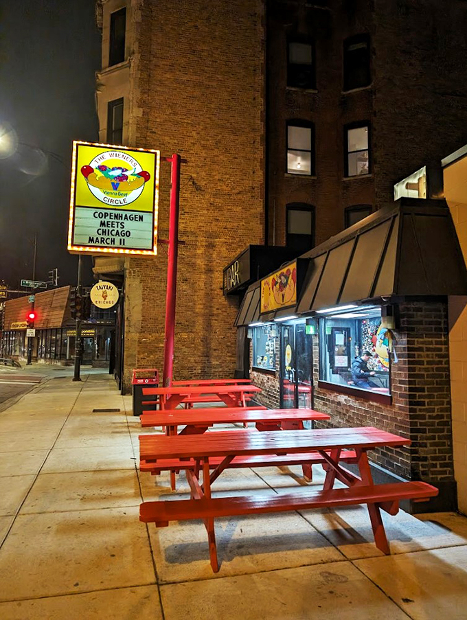 By day, a hot dog haven. By night, a verbal gladiator arena. The Wieners Circle serves up char-grilled greatness with a side of sass.