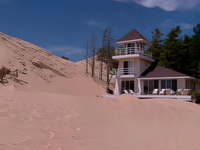 Beach day with a twist of mystery. Sunbathers unknowingly lounge atop a town time forgot. Photo credit: WoodTV