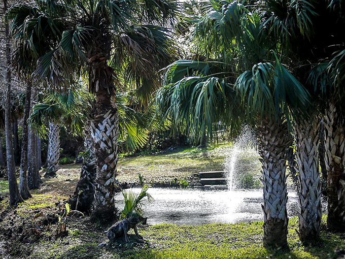 A tranquil fountain creates nature's own meditation spot, surrounded by whispering palms and Florida's natural beauty.