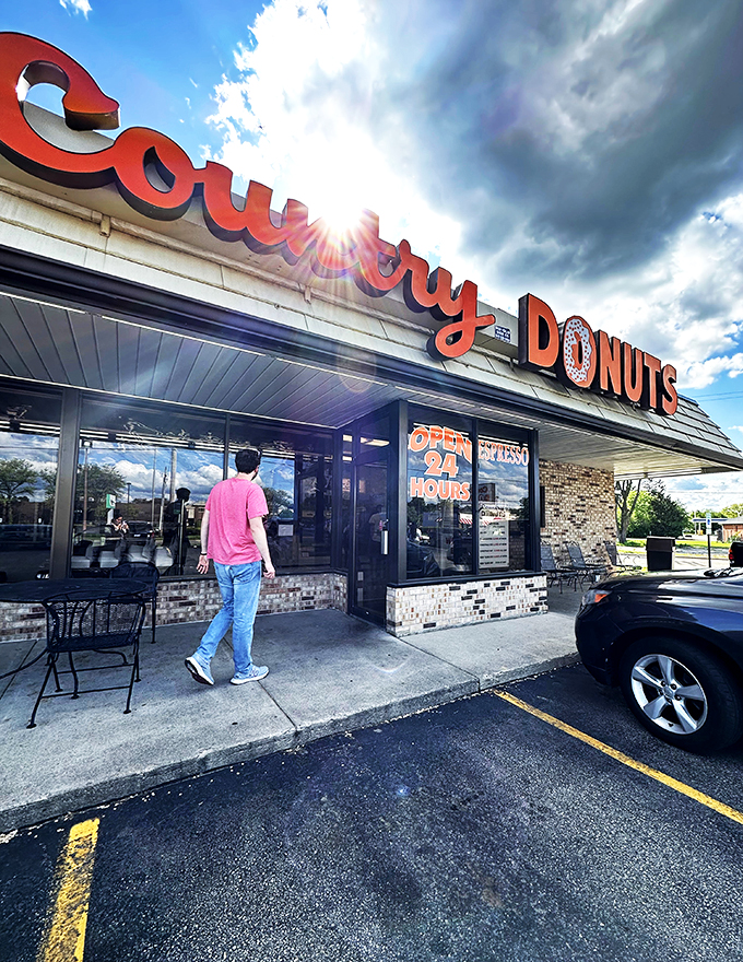 Bright lights, big donuts. Country Donuts stands like a beacon of hope for the hungry, a 24-hour oasis in a desert of closed kitchens.
